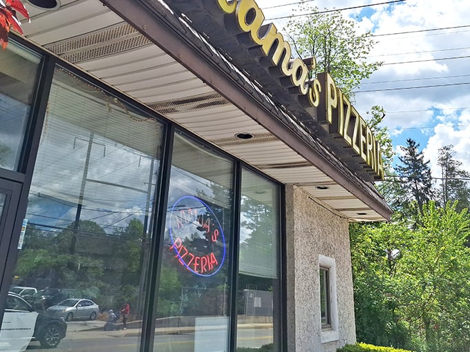 The unassuming yellow sign of Mama's Pizzeria stands as a beacon for sandwich aficionados, promising delicious treasures within those modest walls.