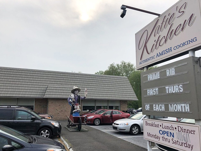 The sign says "Authentic Amish Cooking," but that whimsical statue out front tells you this place has personality beyond the expected bonnets and buggies.