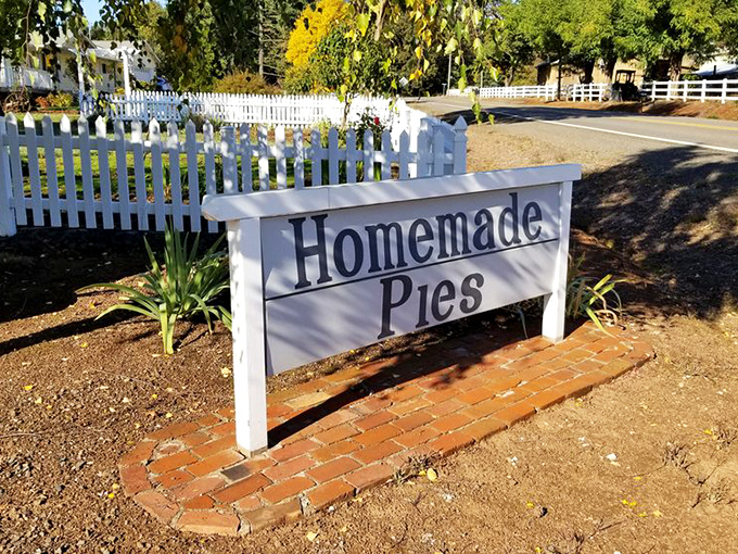 The white picket fence and simple "Homemade Pies" sign might as well read "Abandon diet, all ye who enter here." Pure Americana awaits.