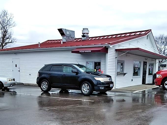 The unassuming white clapboard building with its cheerful red roof stands like a time capsule of Americana, promising sweet relief from Ohio summers.