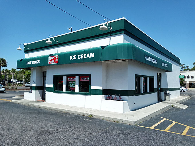The teal and white fa&ccedil;ade of Burky's Grill stands proudly under Carolina blue skies, a mid-century monument to America's love affair with the burger.