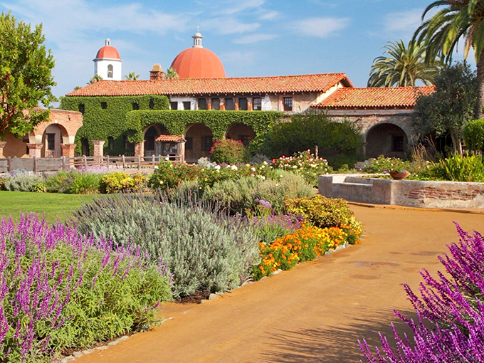 The Mission's gardens bloom with such vibrant colors, it's like Mother Nature decided to throw California's most photogenic garden party.