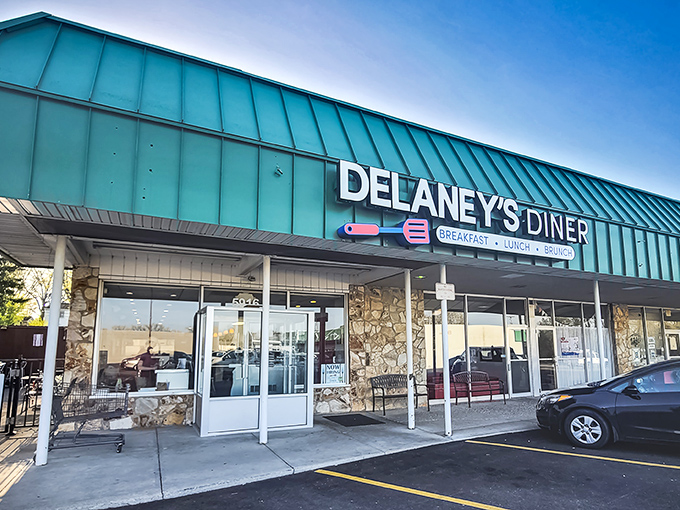 That teal roof isn't just eye-catching&mdash;it's a beacon for hungry souls. Delaney's stone facade promises comfort before you even step inside.