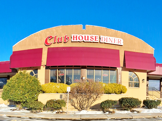The iconic red awning of Club House Diner stands like a beacon of comfort food hope in Bensalem, promising turkey dinners worth the drive from anywhere in Pennsylvania.