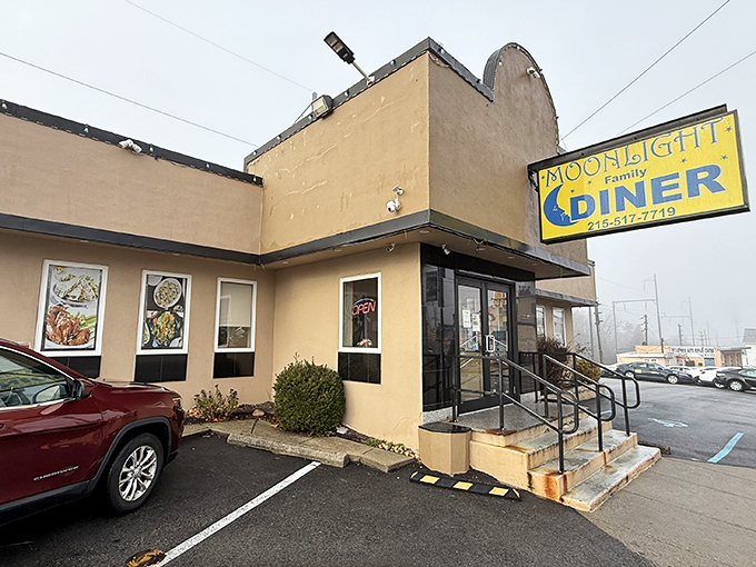 The unassuming tan exterior of Moonlight Diner stands like a breakfast beacon in Glenside, promising comfort food treasures within those humble walls.
