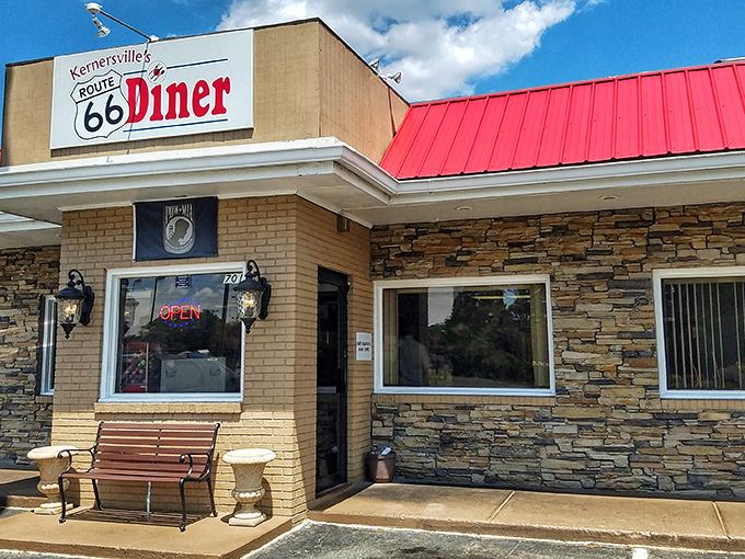 The stone facade and iconic red roof of Kernersville's Route 66 Diner stands as a beacon for hungry travelers seeking authentic comfort food in North Carolina.