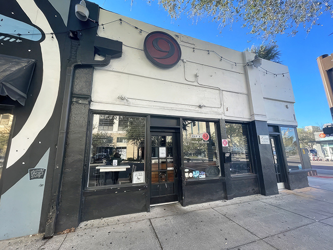 The unassuming exterior of Engine No. 9 hides a burger paradise within. That iconic red "9" logo is like a beacon for hungry St. Pete locals.