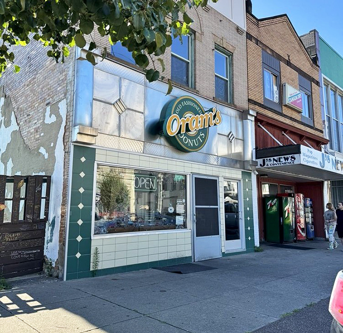 The iconic green and gold sign of Oram's beckons like a lighthouse for the sugar-deprived. This unassuming storefront has launched a thousand diet cheat days since 1938.