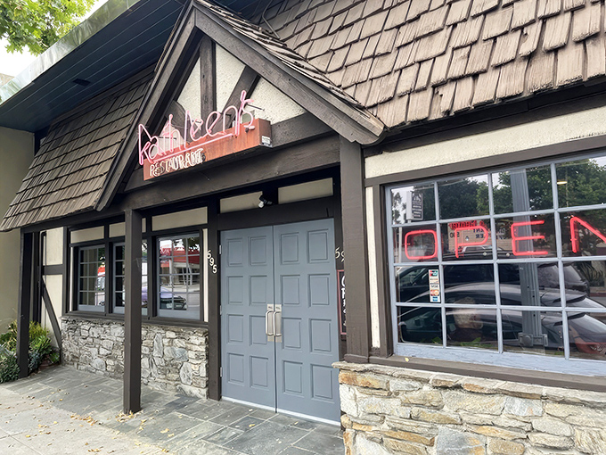 The charming cottage-like exterior of Kathleen's Restaurant beckons with its stone foundation and distinctive shingled roof&mdash;a breakfast sanctuary hiding in plain sight.