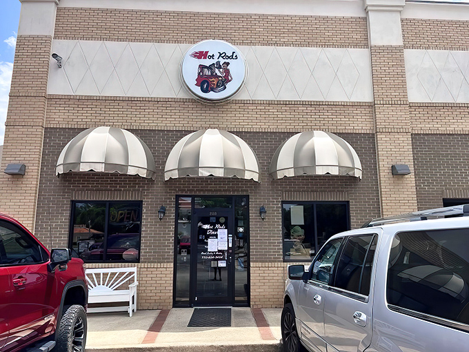 The classic brick exterior with striped awnings isn't just inviting&mdash;it's practically waving you in with promises of comfort food nirvana.