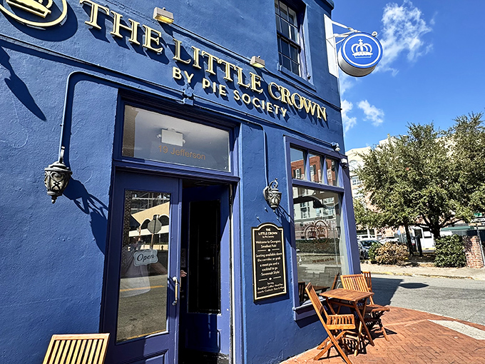 The royal blue facade of The Little Crown stands proudly in Savannah's historic district, beckoning pastry pilgrims with its golden lettering and promise of British delights.