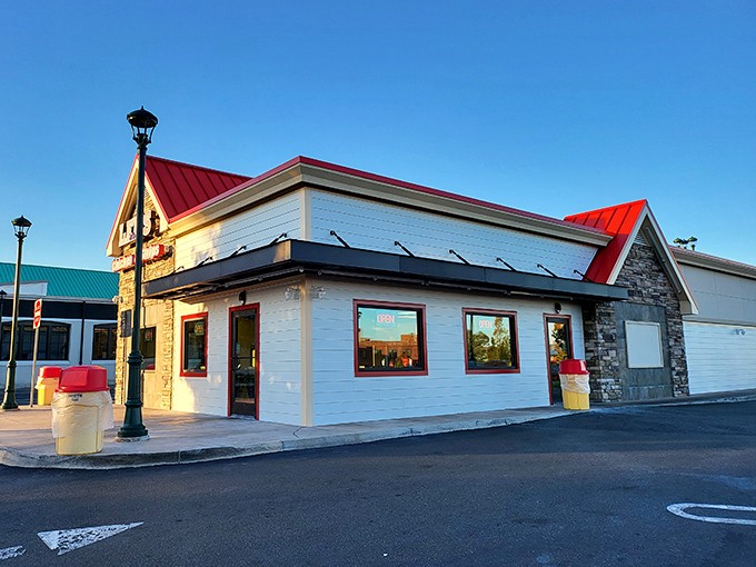 The iconic red-roofed Lee's Famous Recipe Chicken stands like a beacon of comfort food promise, beckoning hungry Virginians with its no-nonsense charm.