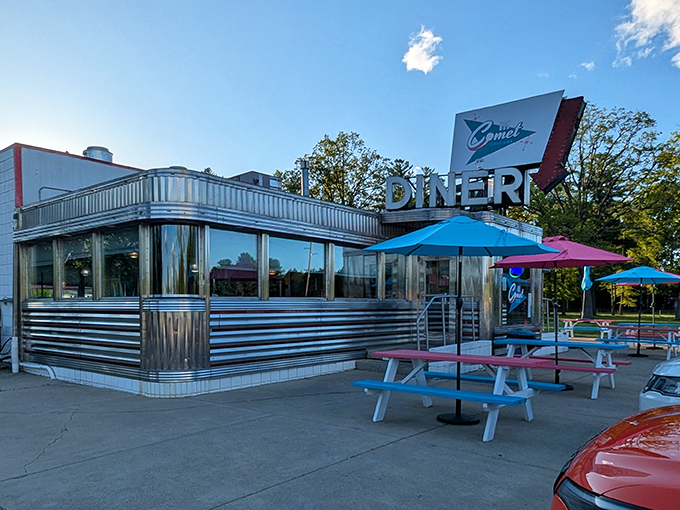 The gleaming stainless steel exterior of The Comet isn't just a diner—it's a time machine with a milkshake menu. Pure mid-century magic.
