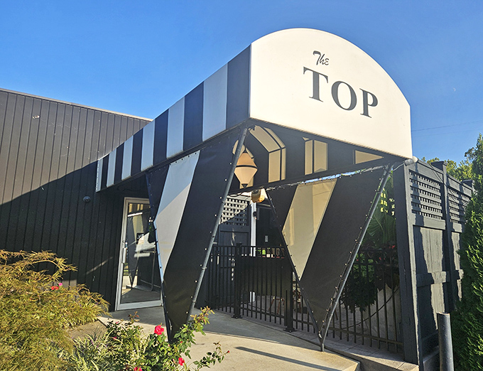 The geometric entrance to The Top Steak House looks like it was plucked straight from a mid-century modern design magazine. Pure retro cool.