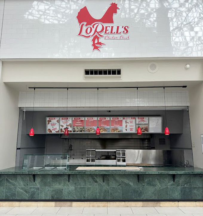 The iconic red chicken logo of LoRell's beckons from its clean, minimalist storefront&mdash;proof that greatness doesn't need flashy advertising.