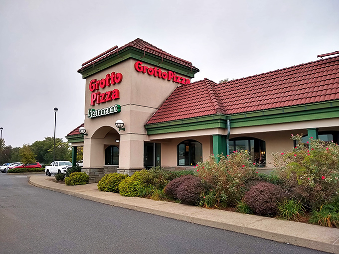 The unassuming exterior of Grotto Pizza hides culinary treasures within, like finding a vintage Rolex at a yard sale.