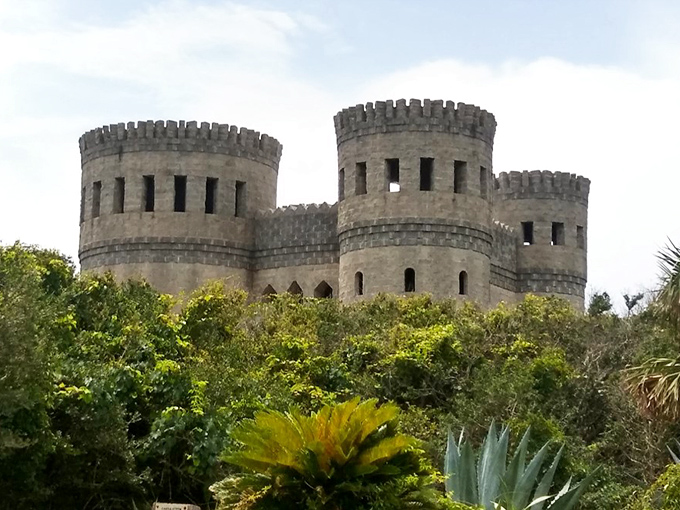 Like a medieval mirage rising from the Florida greenery, Castle Otttis stands proudly with its twin towers reaching skyward, defying both time and geography.