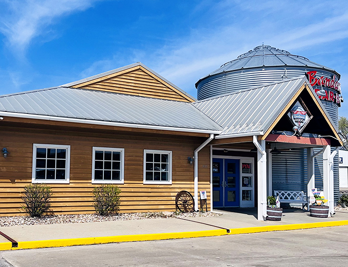 The iconic grain silo with "Bandana's BAR-B-Q" in bold red letters stands like a barbecue lighthouse, beckoning hungry travelers to this rustic wooden haven.
