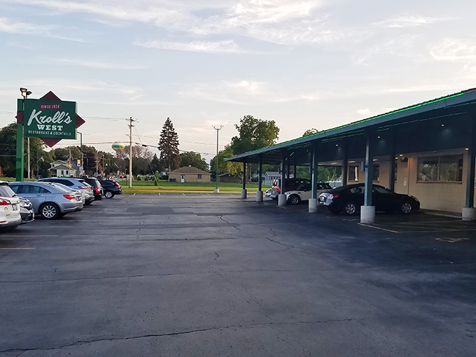 The iconic green-trimmed exterior of Kroll's West stands like a time capsule of Wisconsin dining history, complete with vintage neon sign that beckons hungry travelers.
