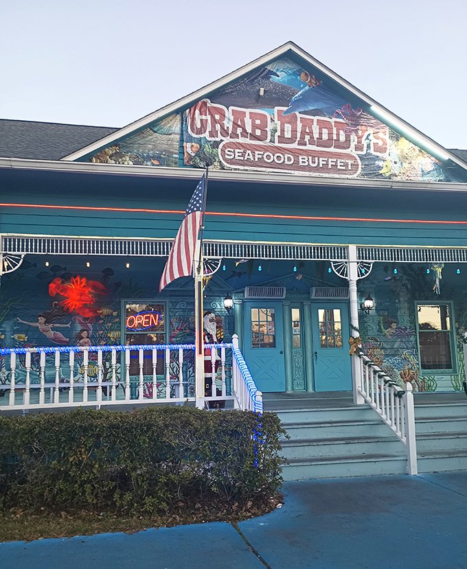 The teal-blue exterior of Crab Daddy's beckons like a siren call to seafood lovers. That glowing "OPEN" sign might as well say "PARADISE FOUND."