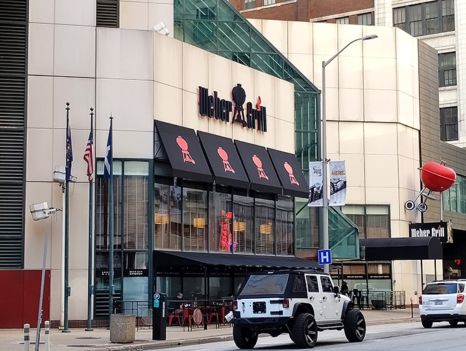 The iconic Weber Grill Restaurant stands proudly in downtown Indianapolis, its distinctive awnings featuring the silhouette of their famous kettle grills.