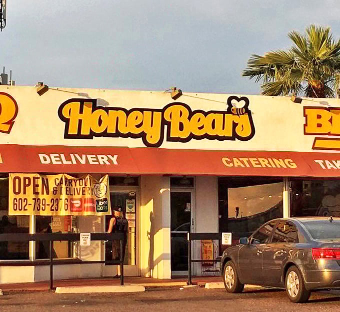 The unassuming yellow storefront of Honey Bear's BBQ stands like a beacon of smoky promise in the Phoenix sun.