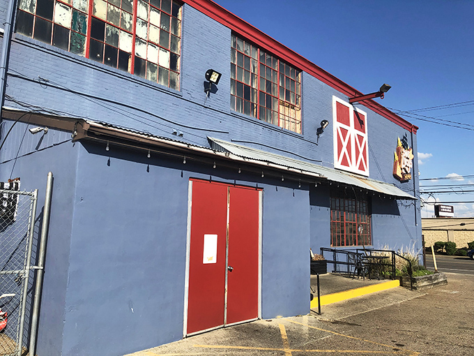 The blue exterior with barn-red trim might not scream "barbecue royalty," but like any great superhero, Sweet Lucy's keeps its powers disguised until you step inside.