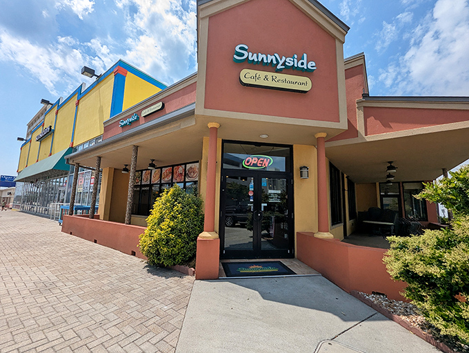 The coral and yellow exterior of Sunnyside Cafe stands like a beacon of breakfast hope among Virginia Beach's commercial landscape &ndash; unassuming yet irresistible.