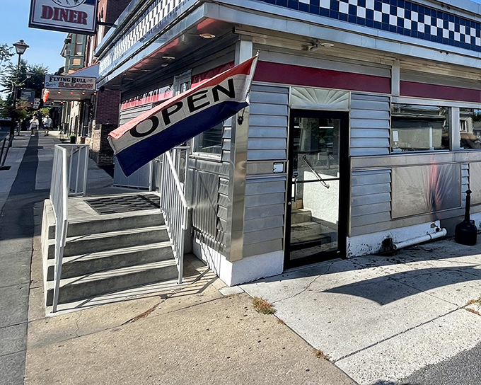 The classic checkerboard trim and stainless steel exterior of Lincoln Diner stands as a beacon of comfort food in historic Gettysburg.