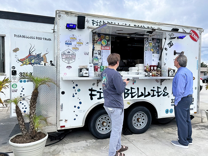 The culinary mothership has landed! Fish Bellies' unassuming white food truck promises seafood magic that would make Neptune himself line up with the locals.