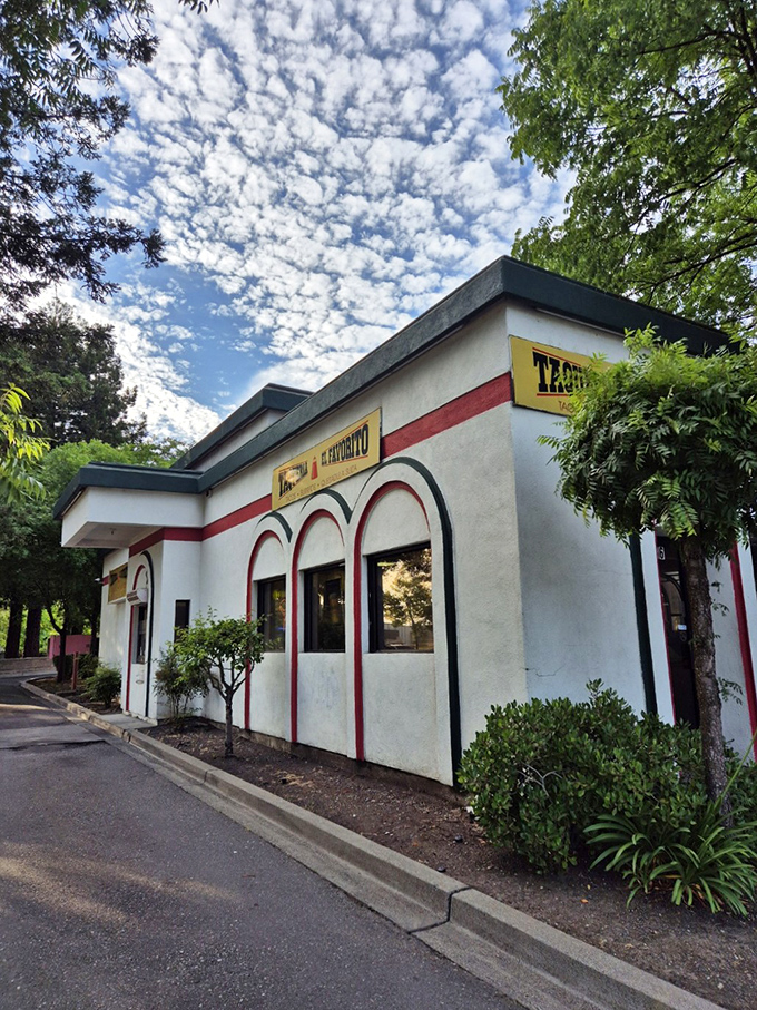 The unassuming exterior of Taqueria El Favorito proudly wears Mexico's colors like a badge of honor. This little building holds big flavors inside.
