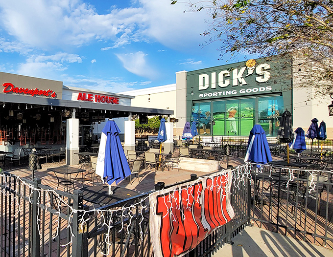 Davenport's welcoming exterior beckons with its bright red signage and inviting patio—the perfect spot to escape Florida's theme park madness.