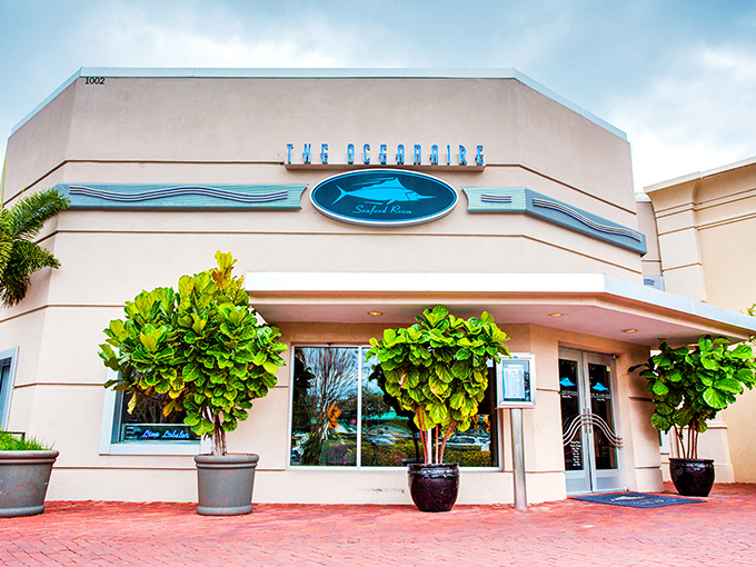 The Oceanaire's elegant exterior stands like a culinary lighthouse amid Orlando's tourist district, promising seafood treasures within those cream-colored walls.