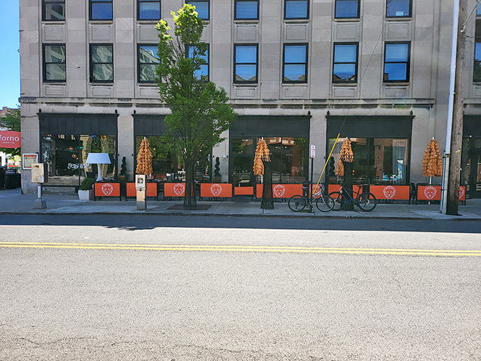 Forno's inviting exterior beckons with cheerful orange umbrellas and sleek design. The Short North hotspot practically whispers, "Come in, we've got pizza that will change your life."