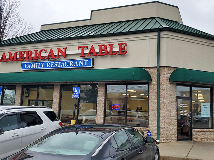 The beacon of breakfast bliss with its unmistakable green awnings and bright red signage announces itself to hungry travelers like a culinary lighthouse.