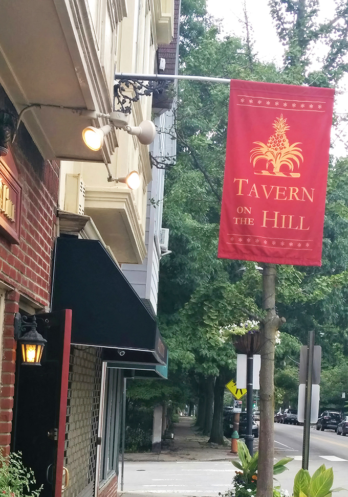 The charming streetscape of Chestnut Hill welcomes you with flowering planters and neighborhood warmth that feels like home.