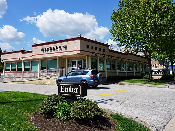 The classic cream-colored exterior of Minella's stands like a beacon of breakfast hope on Lancaster Avenue, promising comfort food salvation to hungry travelers.