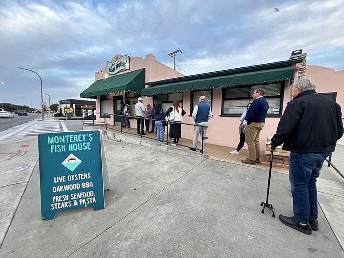 The unassuming pink exterior with a line already forming &ndash; proof that the best seafood spots don't need fancy facades, just fantastic food.