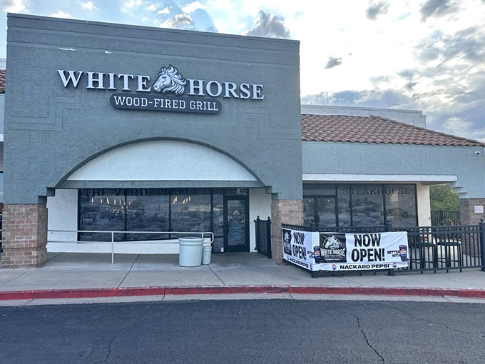 The unassuming exterior of White Horse Wood-Fired Grill proves the old adage: never judge a burger joint by its stucco facade.