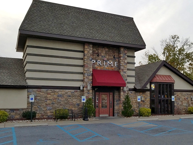 The stone facade of Prime Steak House welcomes hungry travelers with its distinctive red awning&mdash;like a beacon of culinary promise in Bethlehem's dining landscape.