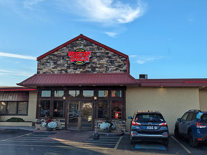 Stone facade meets red metal roofing in this unassuming temple to Southern comfort food excellence.