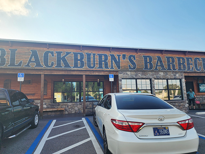 The rustic wooden facade of Blackburn's Barbecue stands like a beacon of smoky promise under Florida's blue skies, beckoning hungry travelers with its no-nonsense charm.