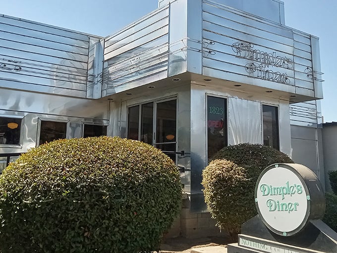 The gleaming Art Deco exterior of Dimples Diner stands like a chrome-plated time machine, promising breakfast dreams come true inside.