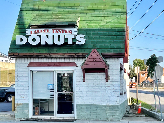The iconic green-shingled roof and weathered "DONUTS HAMBURGERS" sign announce this Laurel institution without fanfare&mdash;architectural honesty at its most delicious.