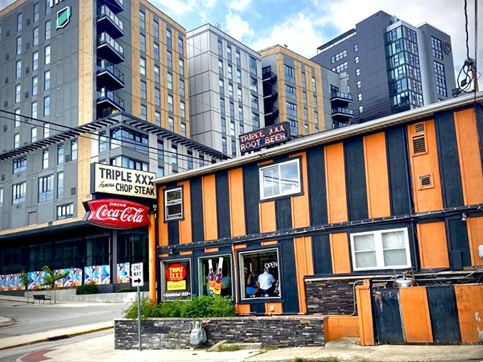 The unmistakable orange and black stripes of Triple XXX stand defiant against modern West Lafayette, like a time machine that happens to serve incredible burgers.