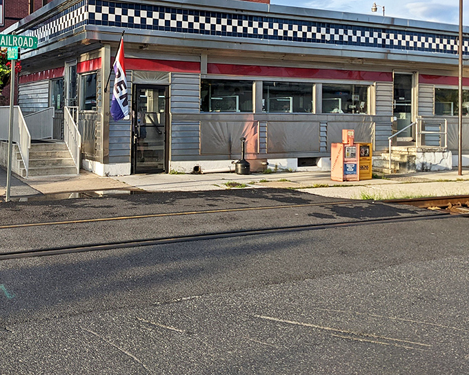 The classic checkerboard trim and stainless steel exterior of Lincoln Diner stands as a beacon of comfort food in historic Gettysburg.