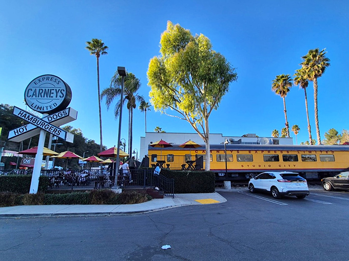 The bright yellow train car of Carney's stands out against the California sky like a beacon of burger hope on Ventura Boulevard.
