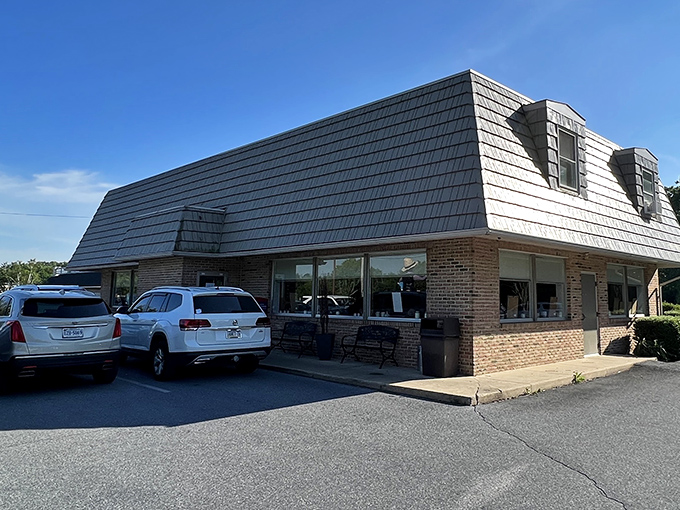 The distinctive mansard roof of Katie's Kitchen stands like a culinary lighthouse in Amish Country, beckoning hungry travelers with promises of comfort food perfection.
