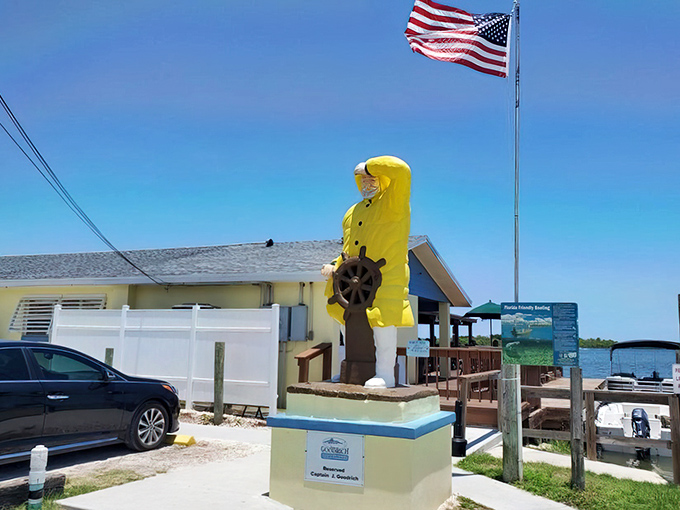 The iconic yellow fisherman statue stands guard outside Goodrich, like a salty sentinel promising treasures from the sea within.