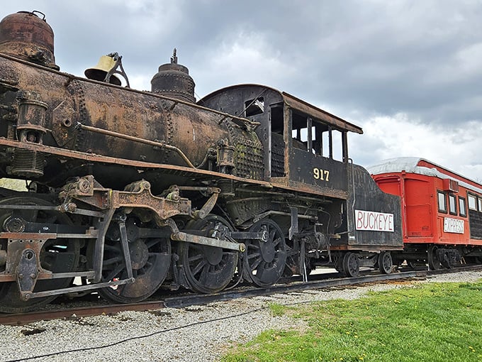 The majestic 917 locomotive stands sentinel outside the Buckeye Express, its weathered steel telling tales of journeys past while promising delicious adventures ahead.
